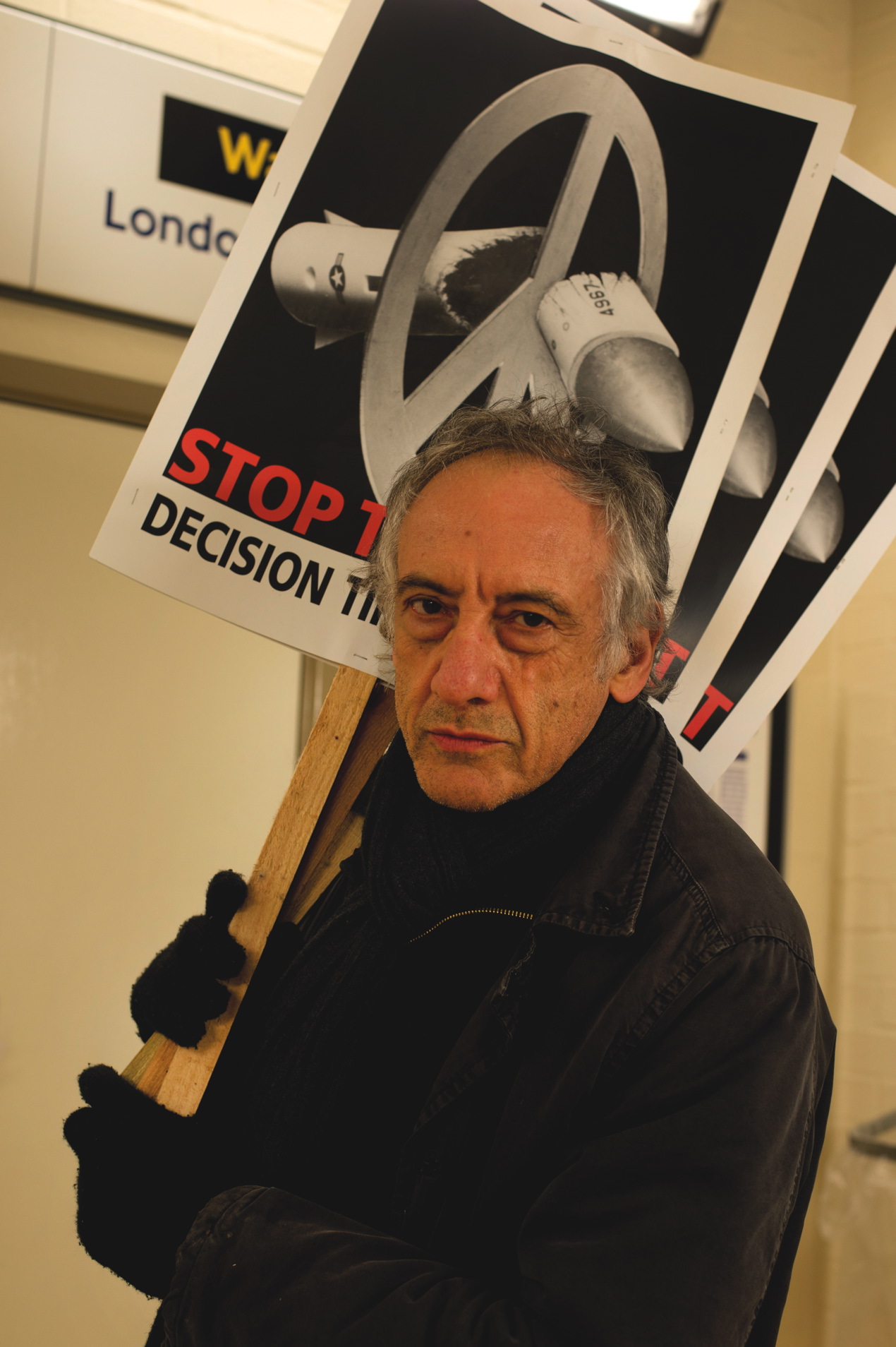 9. Artist Peter Kennard holding Broken Missile poster. Image © Jenny ...